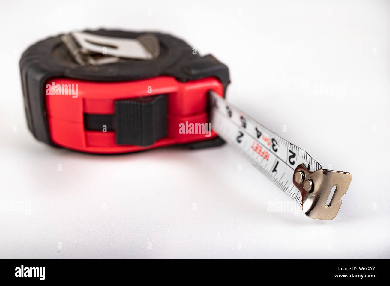 Metal measure of joinery on a white table. Accessories for production ...