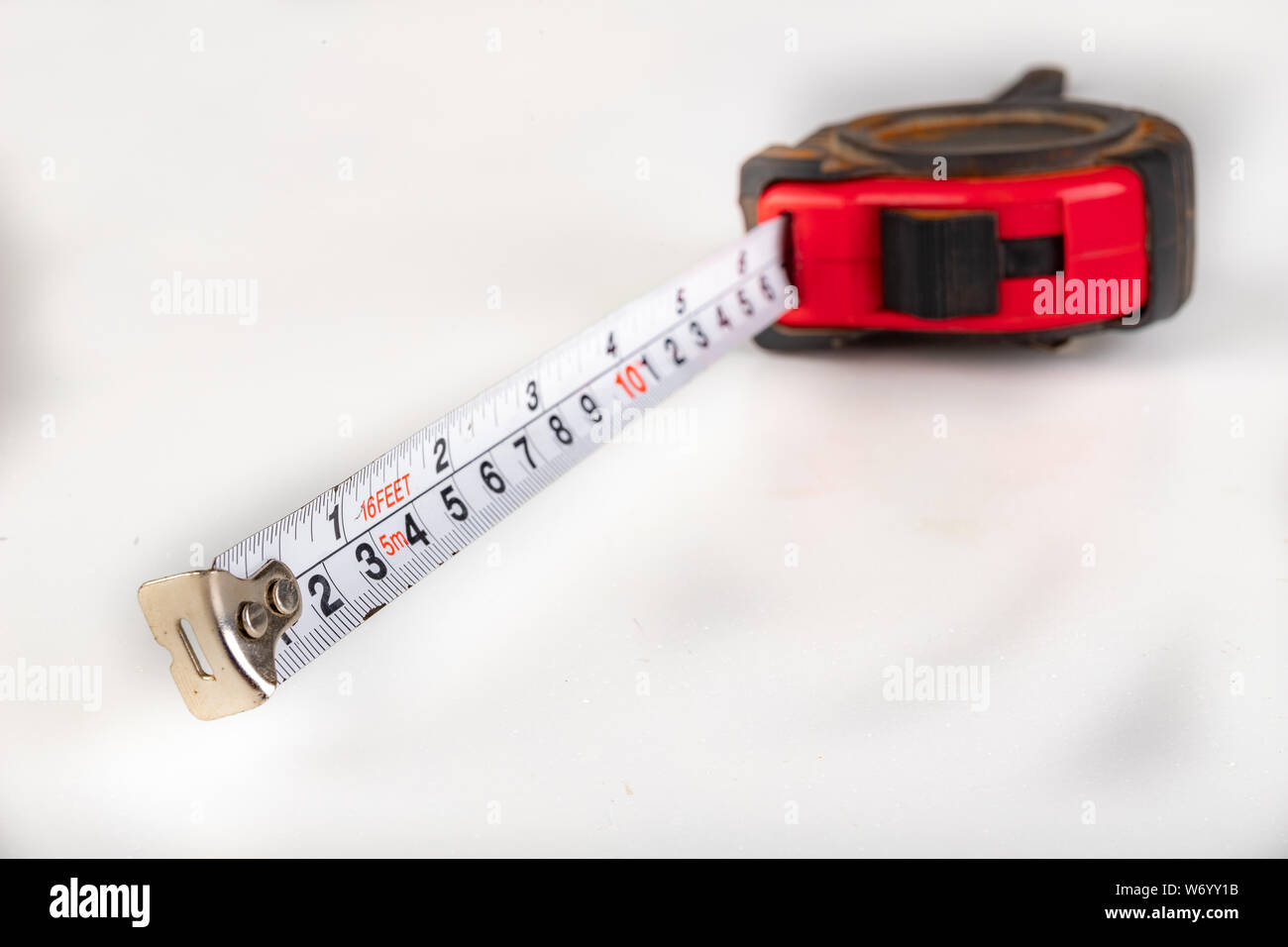 Metal measure of joinery on a white table. Accessories for production ...