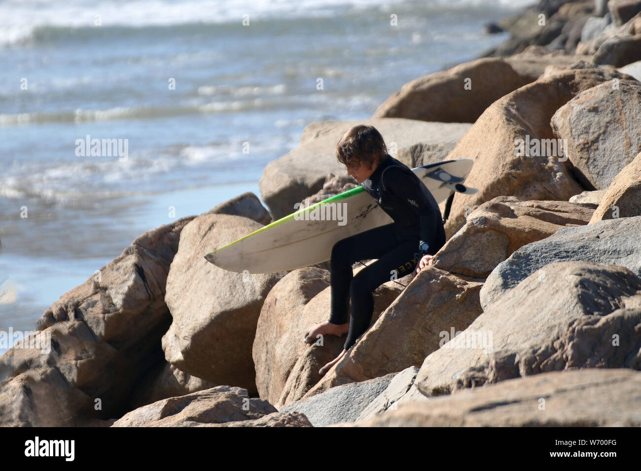 Kids surfing and beach fun Stock Photo - Alamy