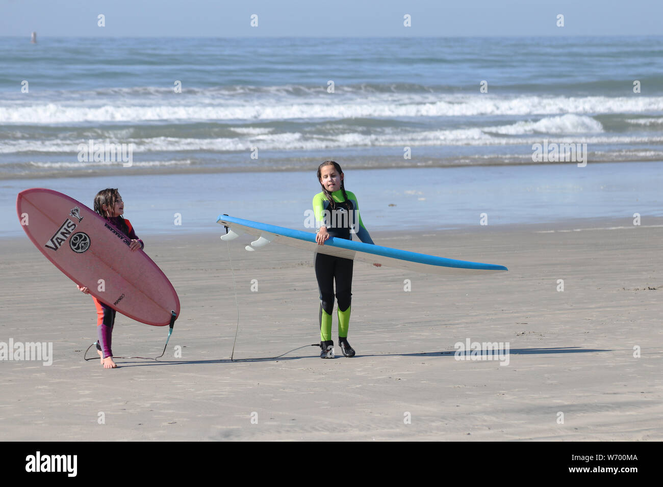 Kids surfing and beach fun Stock Photo - Alamy