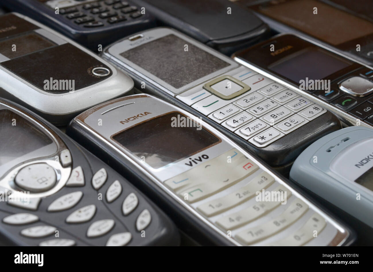 KHARKIV, UKRAINE - JULY 30, 2019: Bunch of old used outdated mobile ...
