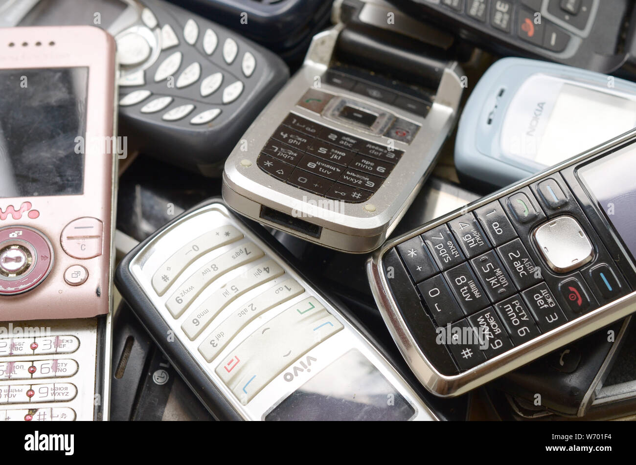 KHARKIV, UKRAINE - JULY 30, 2019: Bunch of old used outdated mobile ...