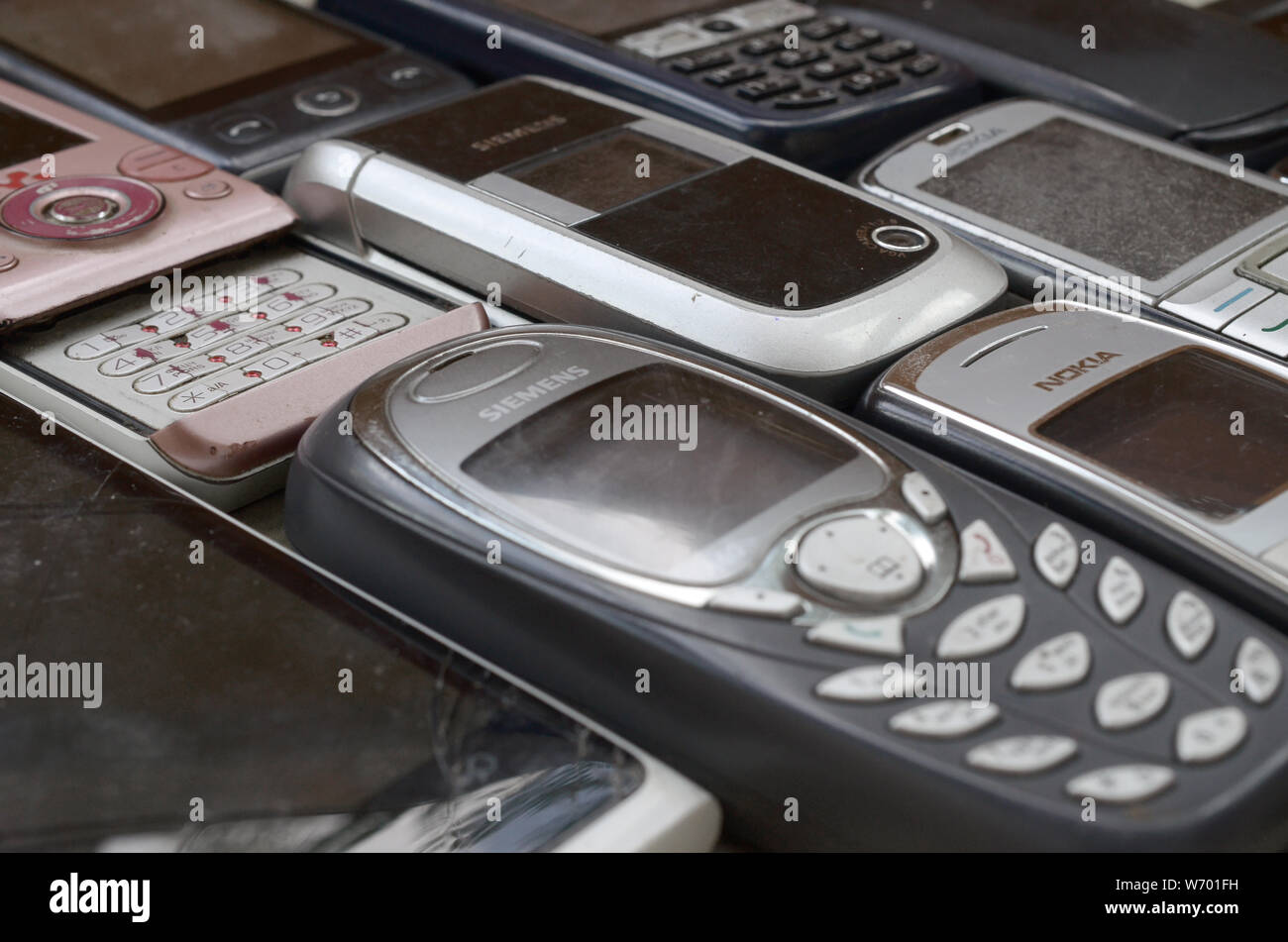 KHARKIV, UKRAINE - JULY 30, 2019: Bunch of old used outdated mobile ...