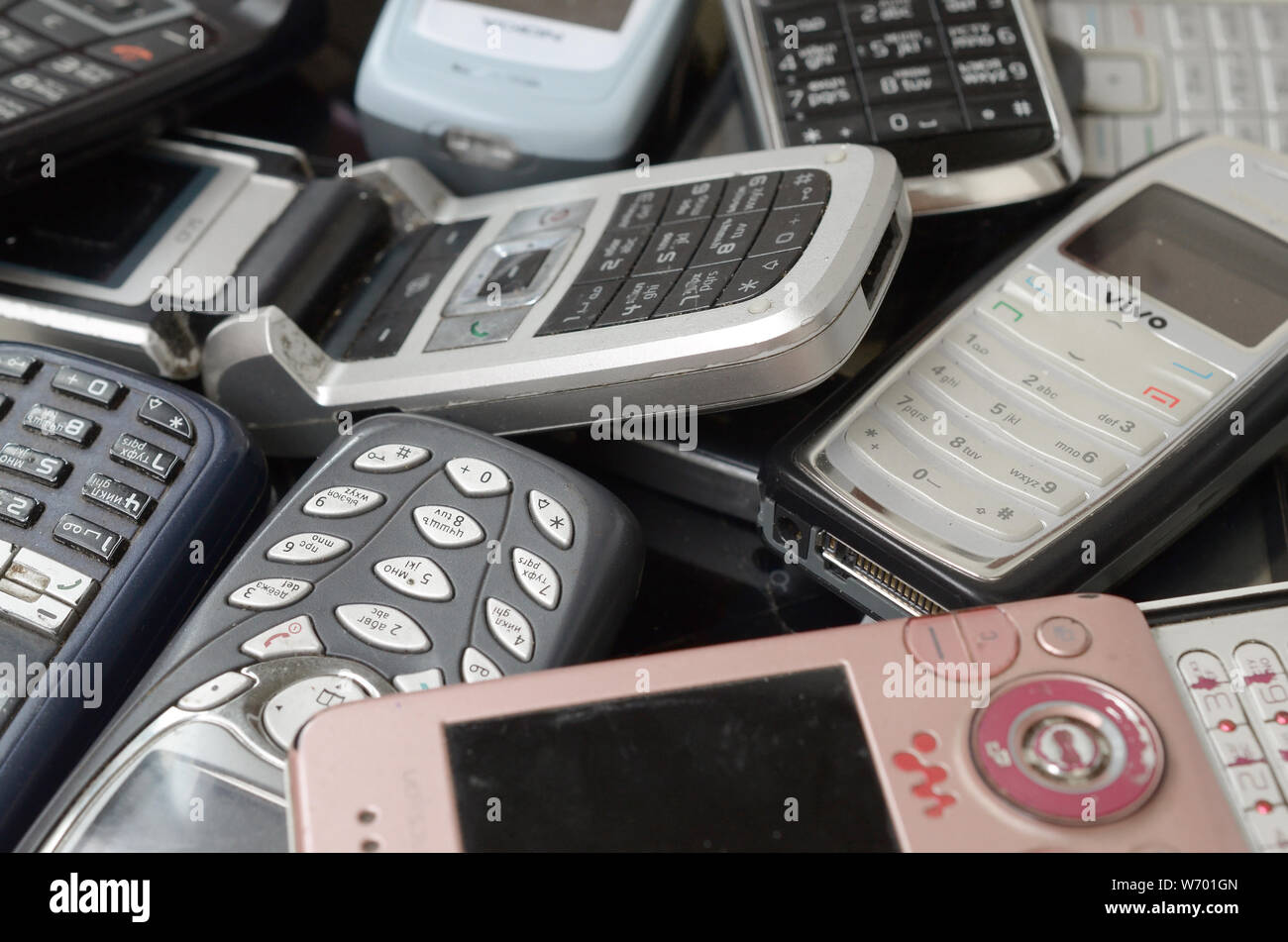 KHARKIV, UKRAINE - JULY 30, 2019: Bunch of old used outdated mobile ...