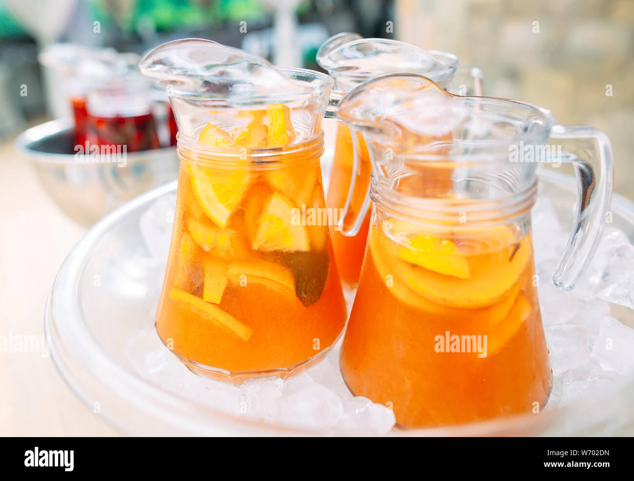 Jugs of fruit lemonade in the ice Stock Photo - Alamy
