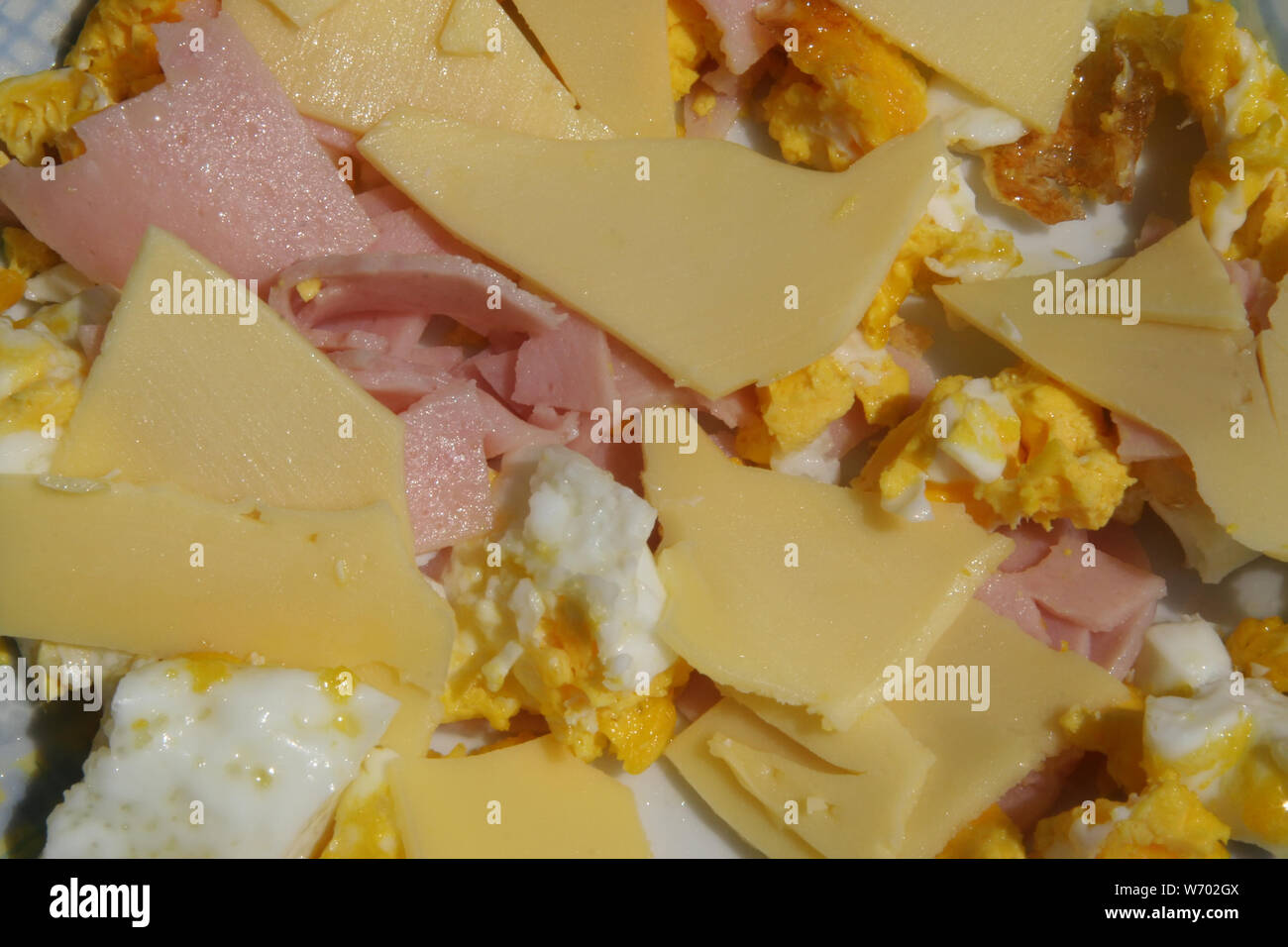 Ham and eggs. Healthy breakfast. Scrambled eggs and ham and cheese ...