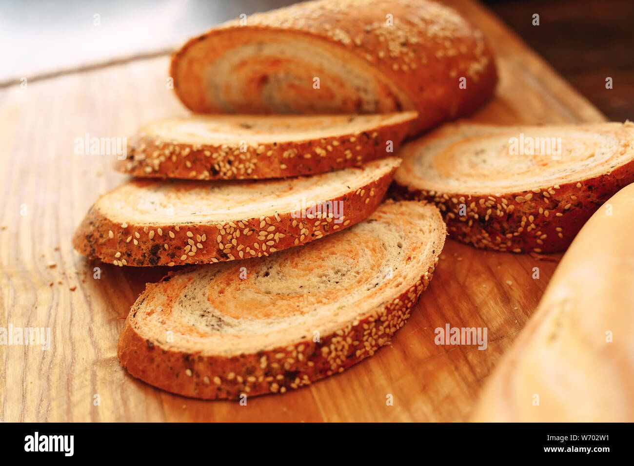 Variety of different fresh bread. sliced loaf of bread Stock Photo - Alamy