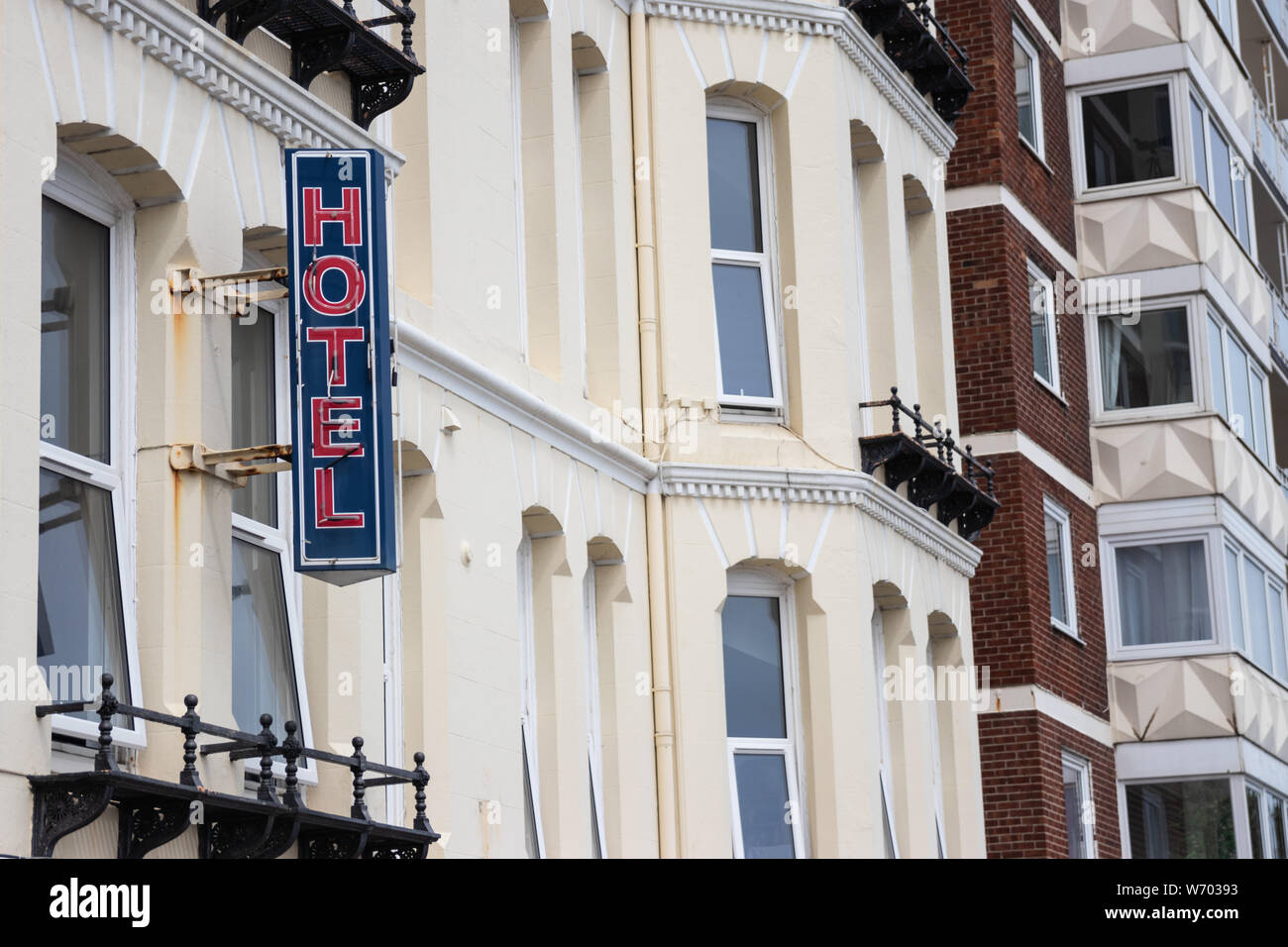 An old Hotel sign on an old Victorian building at the English seaside ...