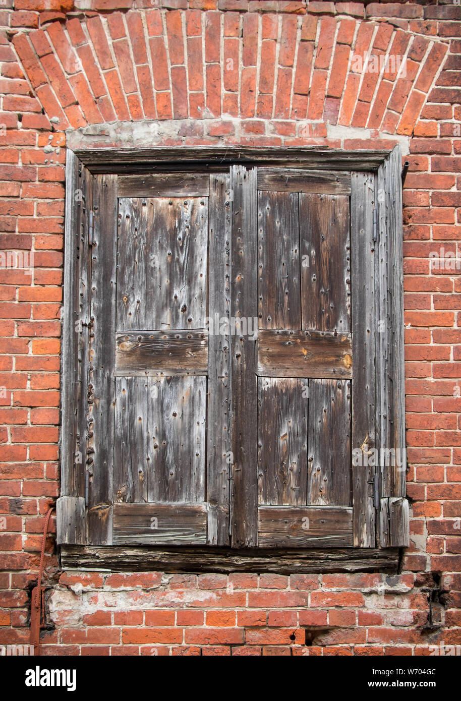 Old closed wooden window with shutters Stock Photo - Alamy