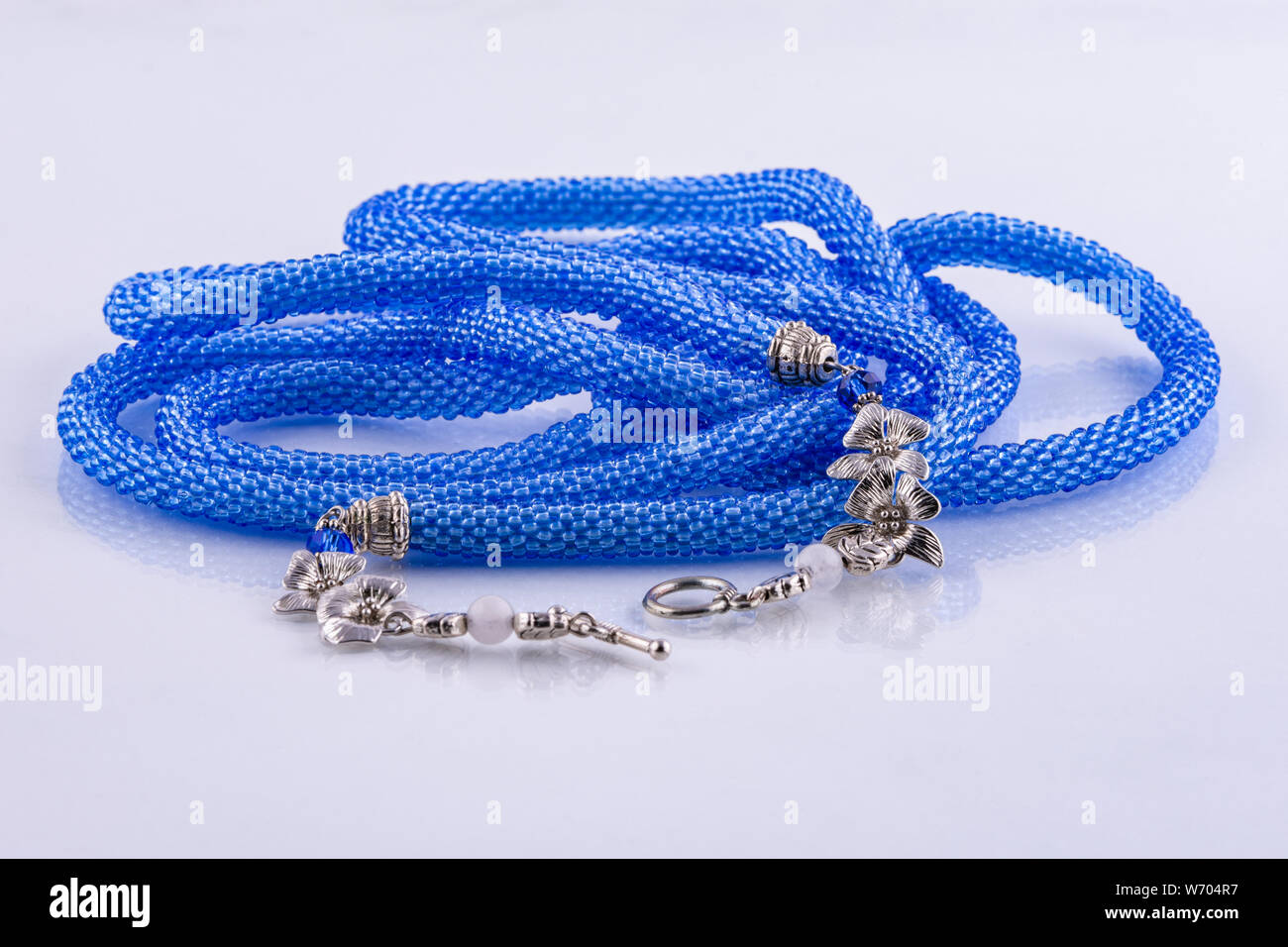 Beautiful blue handmade designer small bead necklace Stock Photo - Alamy