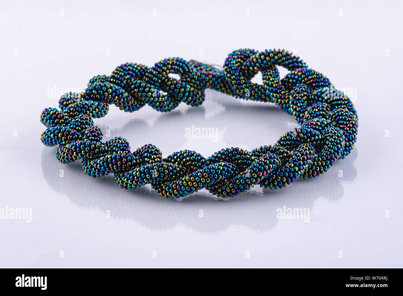 Handmade designer multi-colored bead bracelet Stock Photo - Alamy
