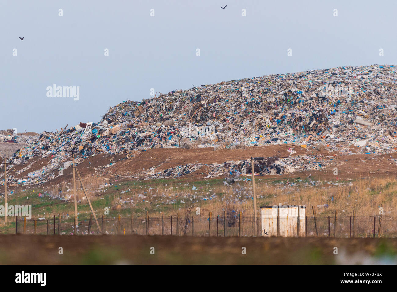 View of a big landfill outside the city behind the gate Stock Photo - Alamy