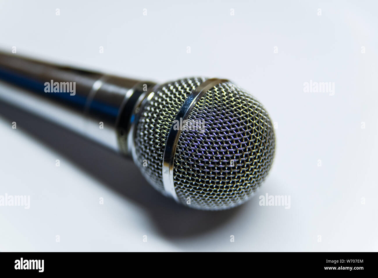 Silver audio microphone on white background surface Stock Photo - Alamy