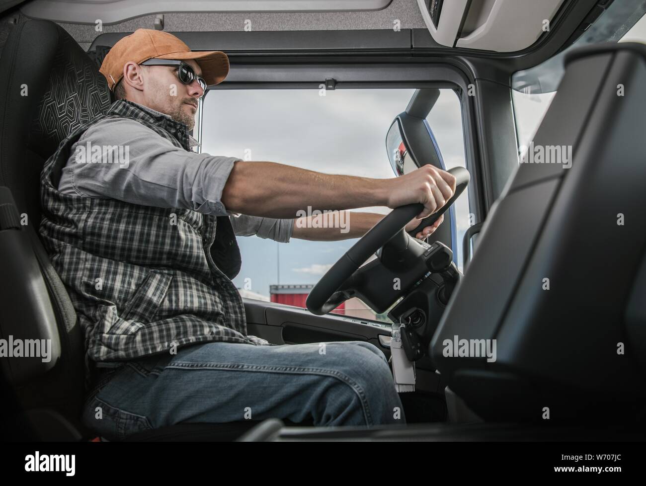 Trucker on the Route to Destination. Cargo Shipping Theme. Caucasian ...
