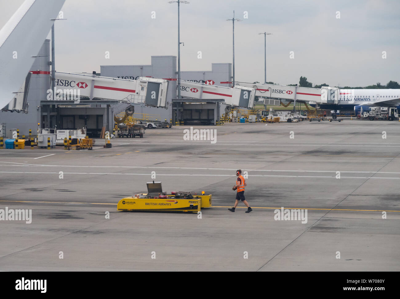 A Mototok remote control electric tug moves a British Airways plane at ...