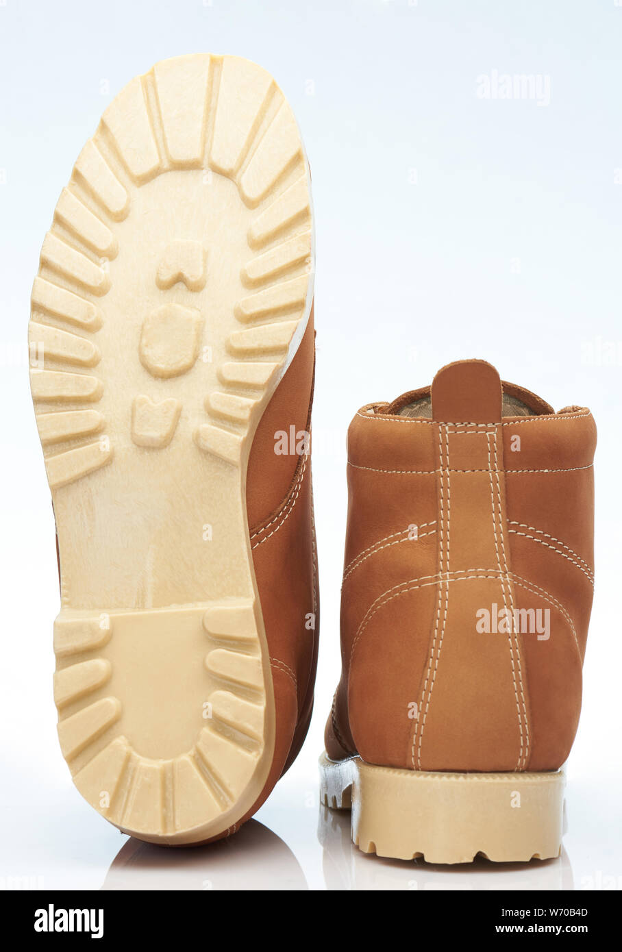 Brown off road shoes bottom and back view isolated Stock Photo - Alamy