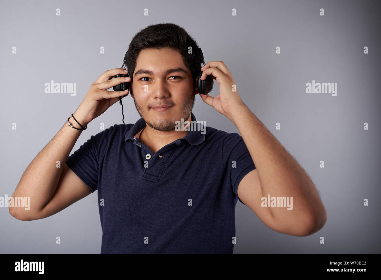 Happy handsome man listening hi-res stock photography and images - Alamy