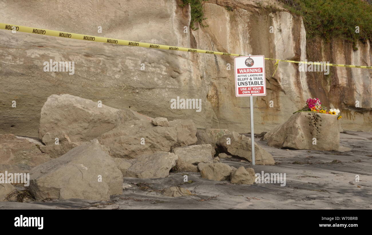 Warning signs and caution tape keep people from unstable cliffs at ...
