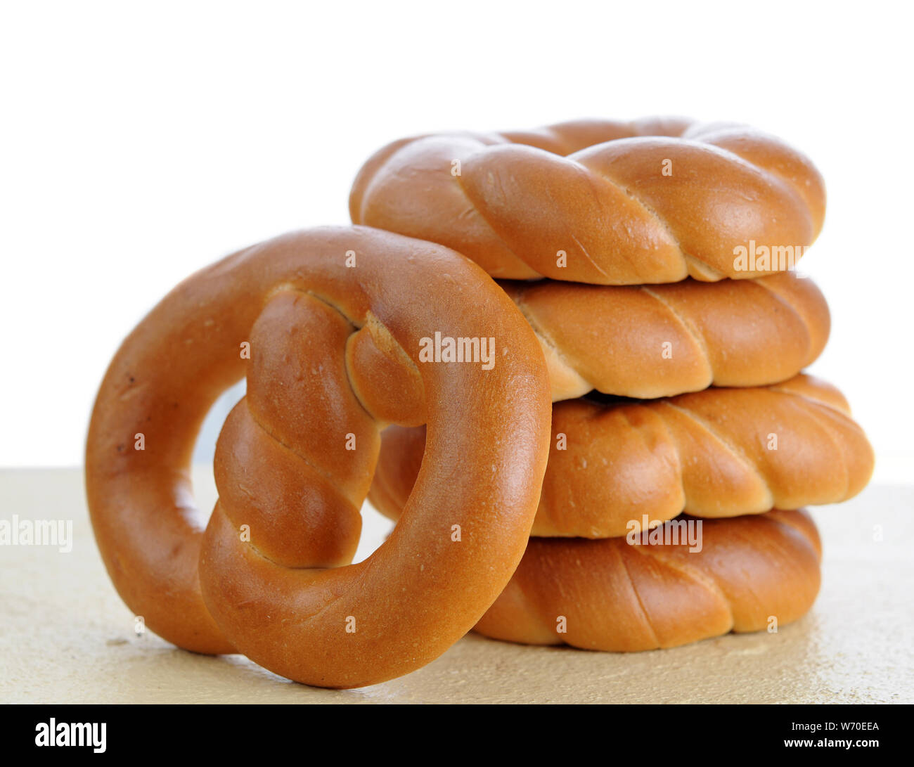 fresh pretzel bread against white background Stock Photo - Alamy