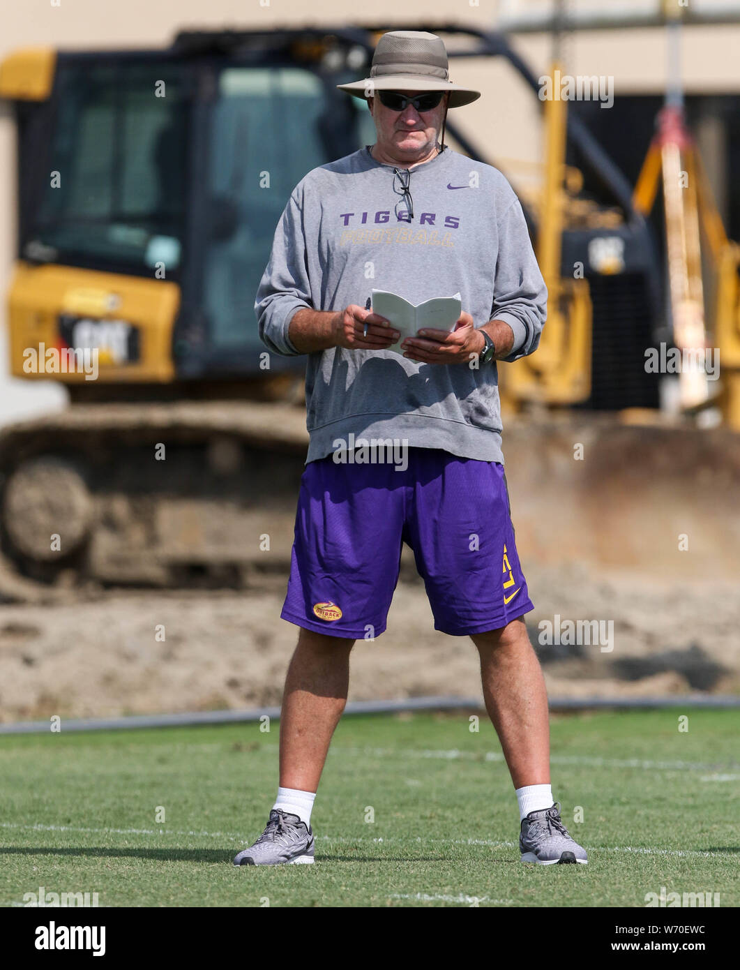 August 3, 2019: LSU offensive coordinator looks at his script during ...