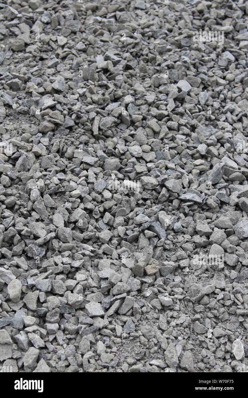 loose crushed rock aggregate gravel (vertical Stock Photo - Alamy