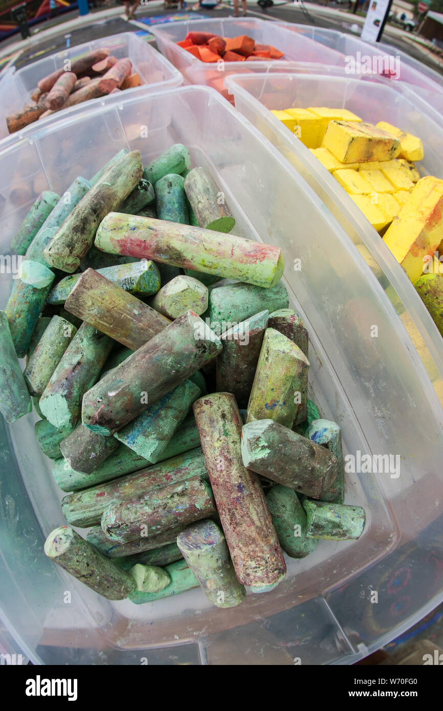 Vertical image of different colors of chalk sitting in plastic ...