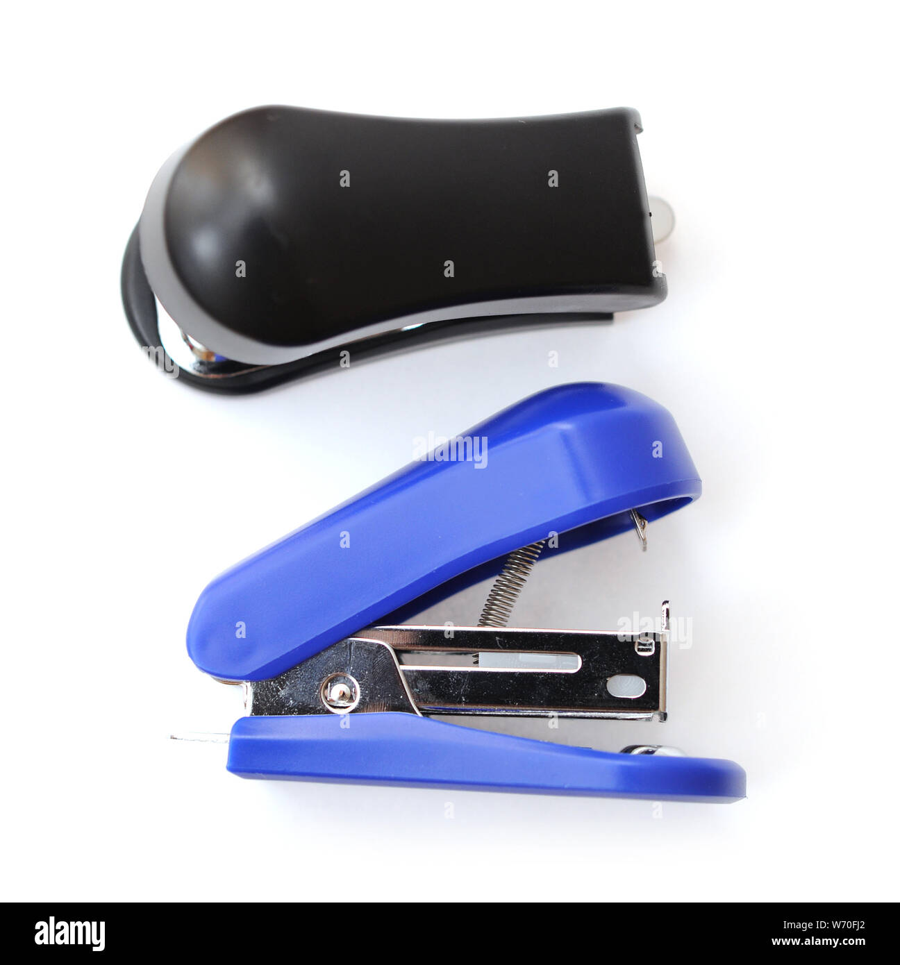 blue and black generic staplers on white background Stock Photo - Alamy