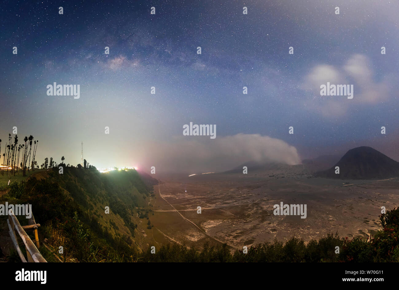 Mount Bromo covered with mist and milky way galaxy stars shining in the ...