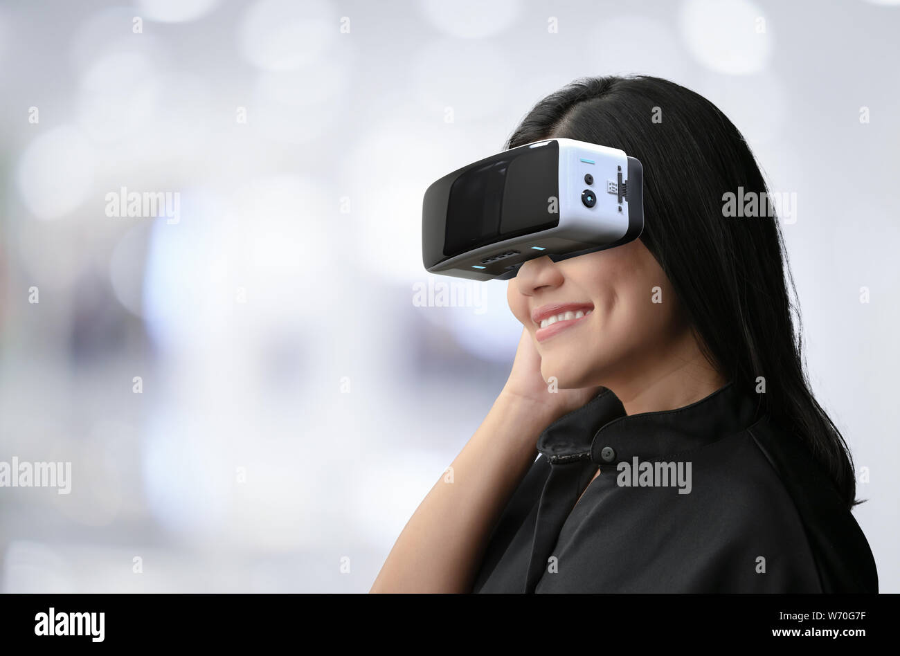 Asian woman wear vr headset and enjoy experience Stock Photo - Alamy