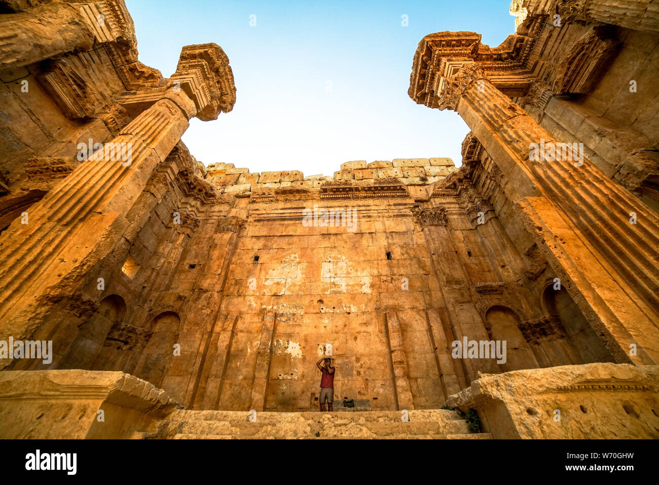 Photographer in ancient Roman Bacchus Temple in beautiful day in ...