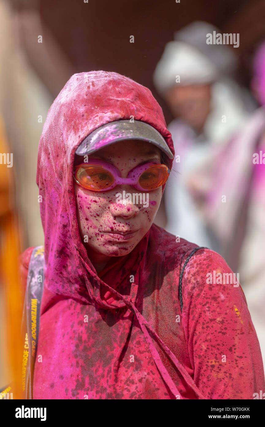 Portrait of a tourish wearing swmiming glasses during Holi Celebrations ...