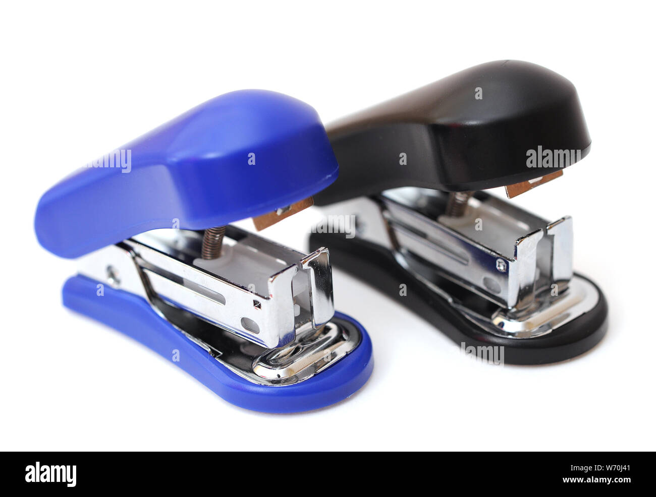 blue and black generic staplers on white background Stock Photo - Alamy