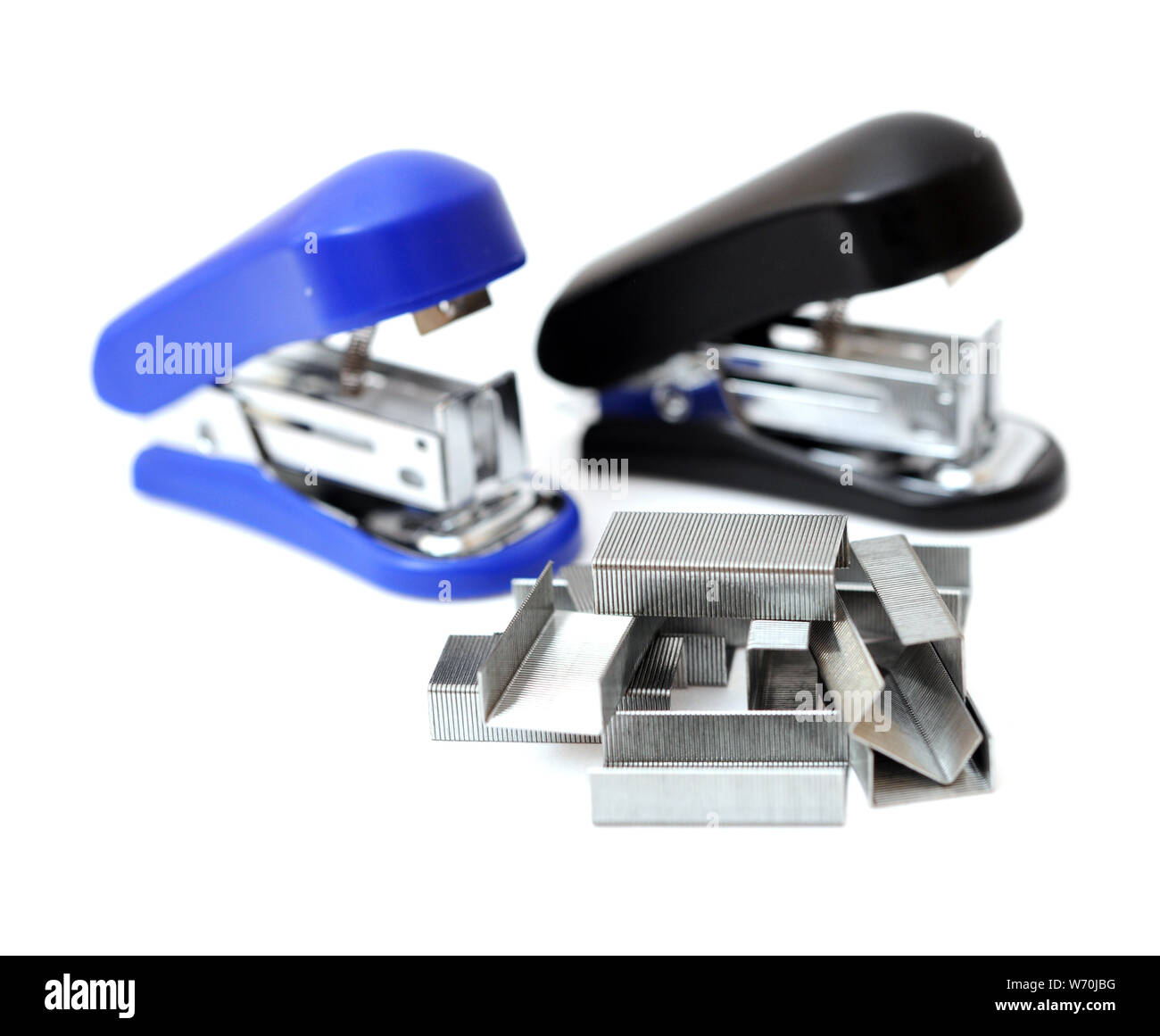 staples and staplers on white background Stock Photo - Alamy