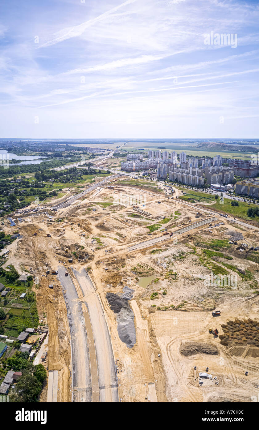 aerial panorama of city construction site. blue sky background Stock ...
