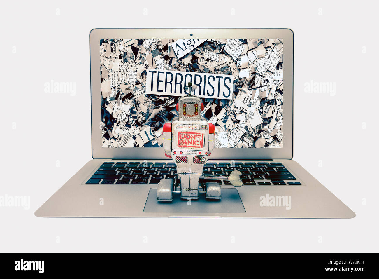 retro robot is reading the news on a laptop computer Stock Photo - Alamy