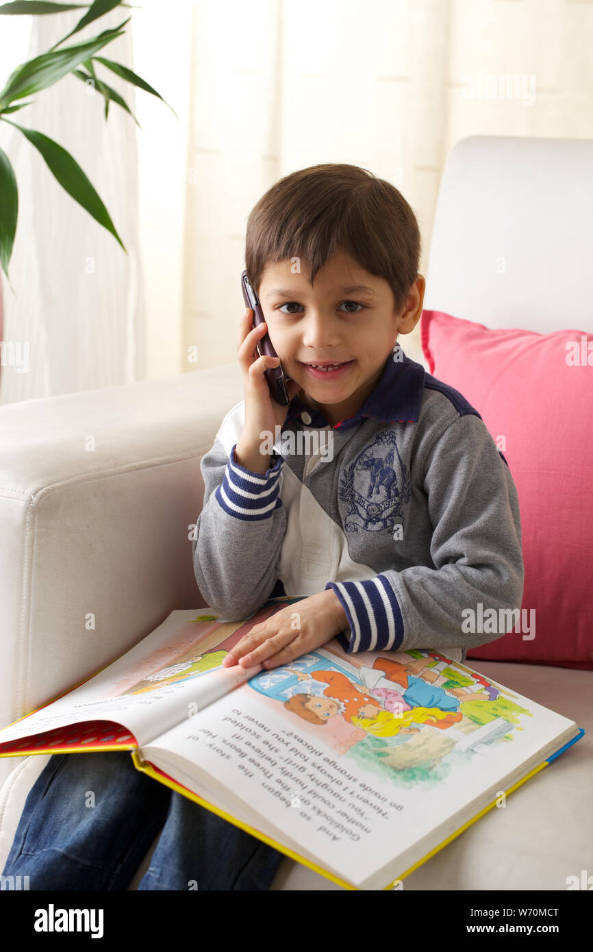 Indian child boy phone talking hi-res stock photography and images - Alamy