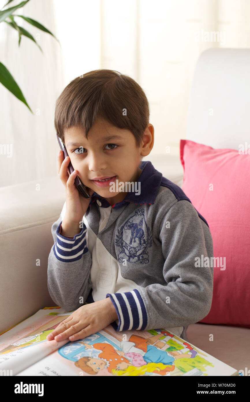 Child phone book couch hi-res stock photography and images - Alamy