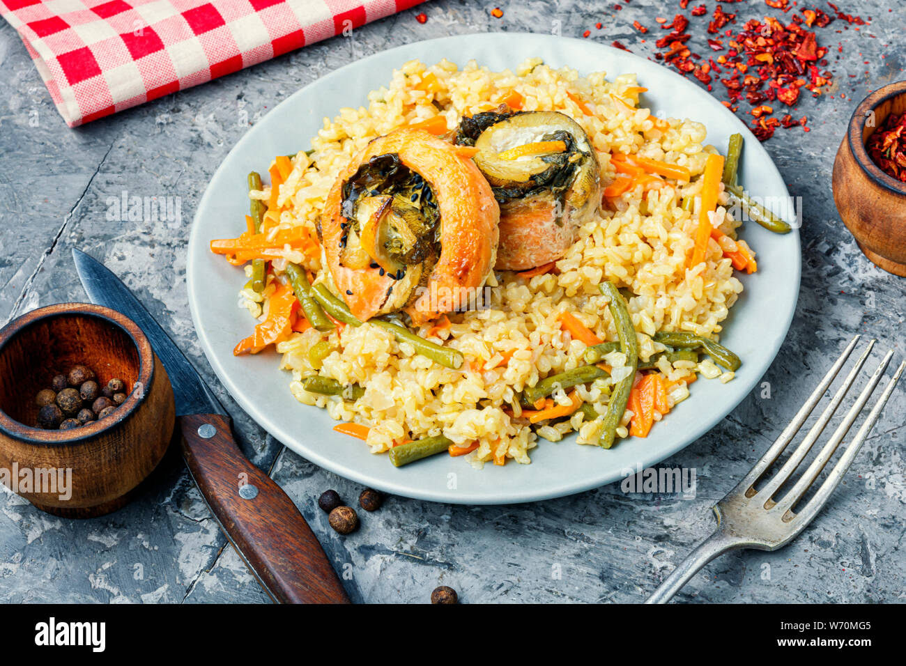 Fried rice with seafood.Traditional seafood paella.Rice with salmon and ...