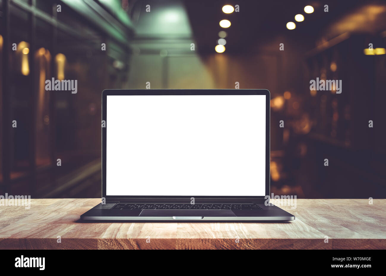 Modern computer,laptop on counter bar with blur cafe,restaurant ...
