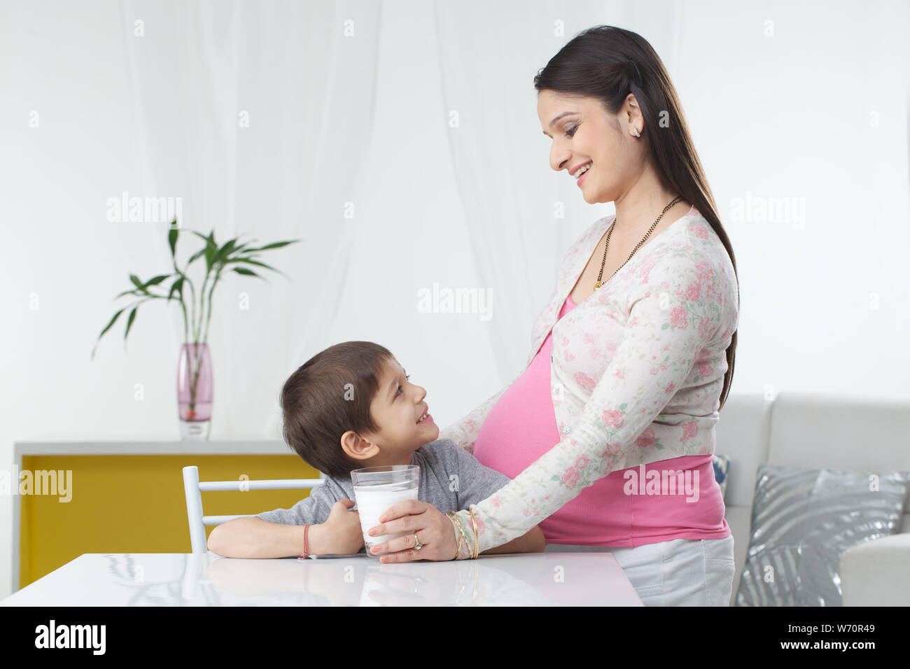 Woman giving milk son hi-res stock photography and images - Alamy