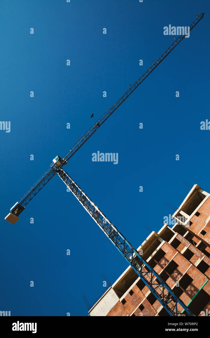 Abstract composition of building buildings, big crane and construction ...