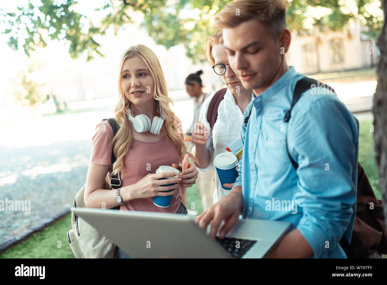 Concentrated students making up their project together Stock Photo - Alamy