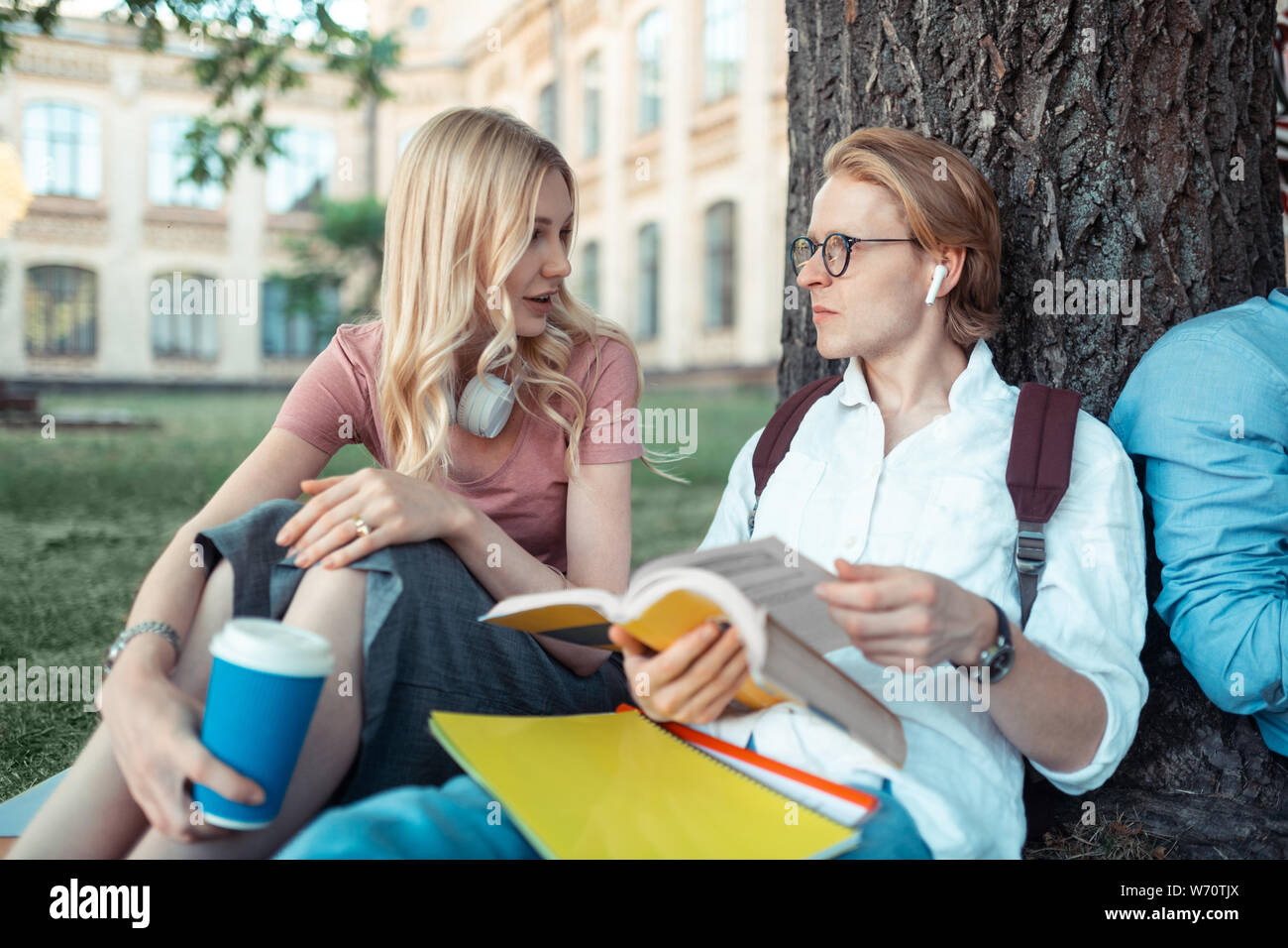 Girl talking with her smart groupmate about their task Stock Photo - Alamy