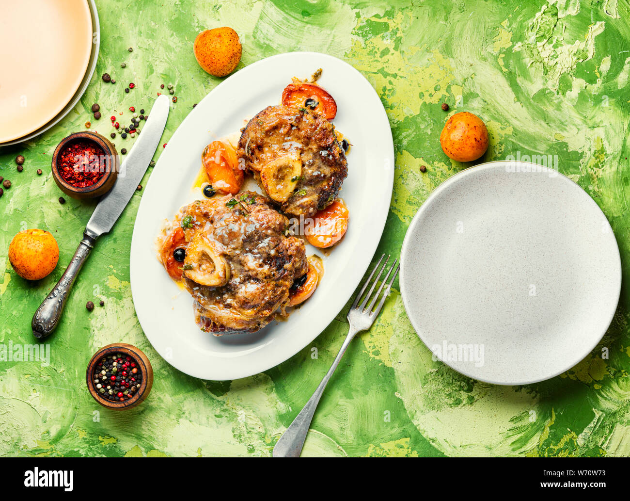 Ossobuco, traditional dish of Italian cuisine. Stewed veal leg.Italian ...