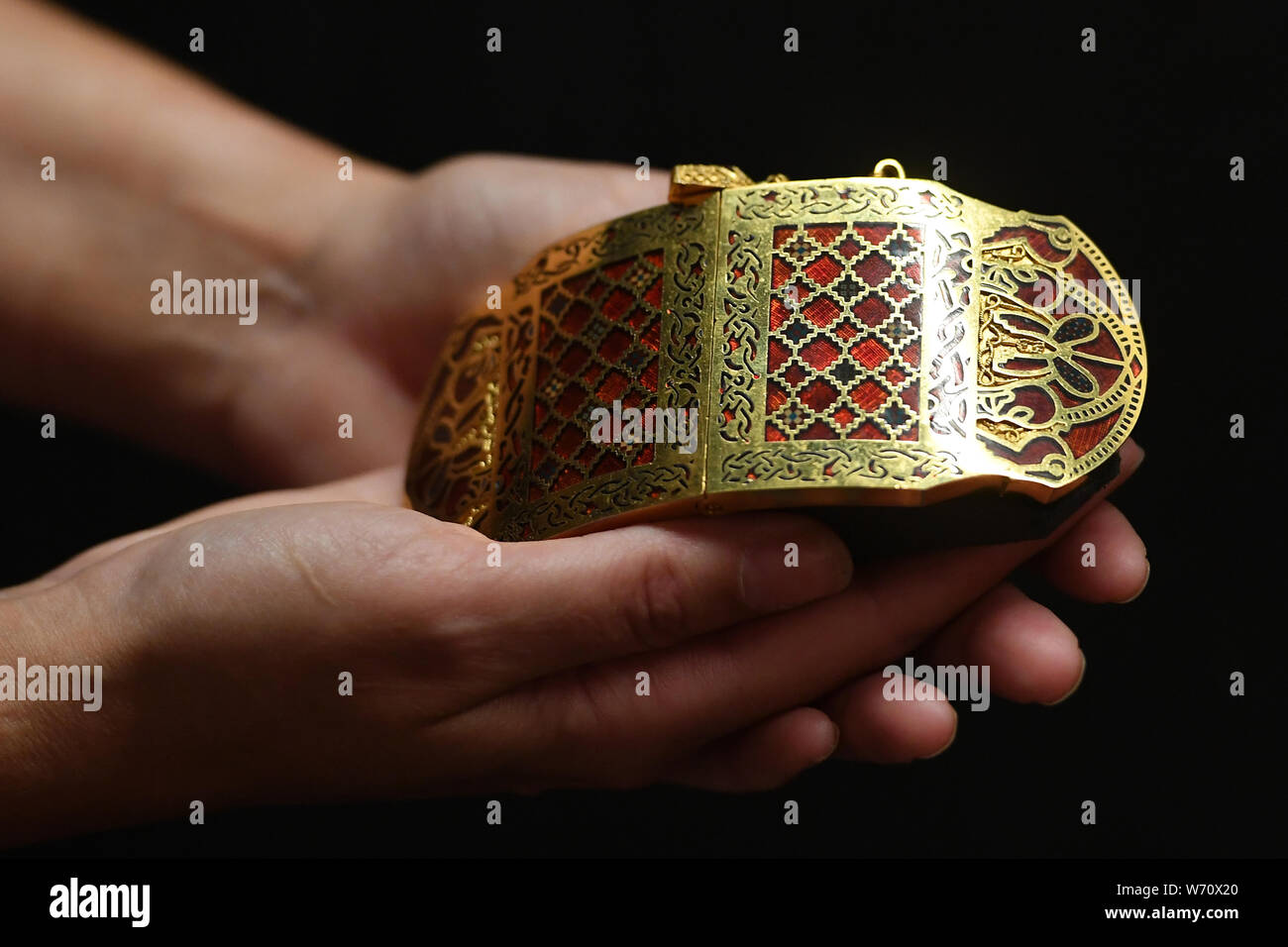 EMBARGOED TO 0001 MONDAY AUGUST 5 A replica of an ornate shoulder clasp ...