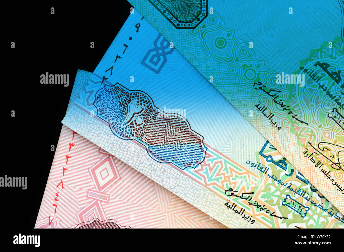 UAE dirham currency notes close up. Money background blue color toned ...