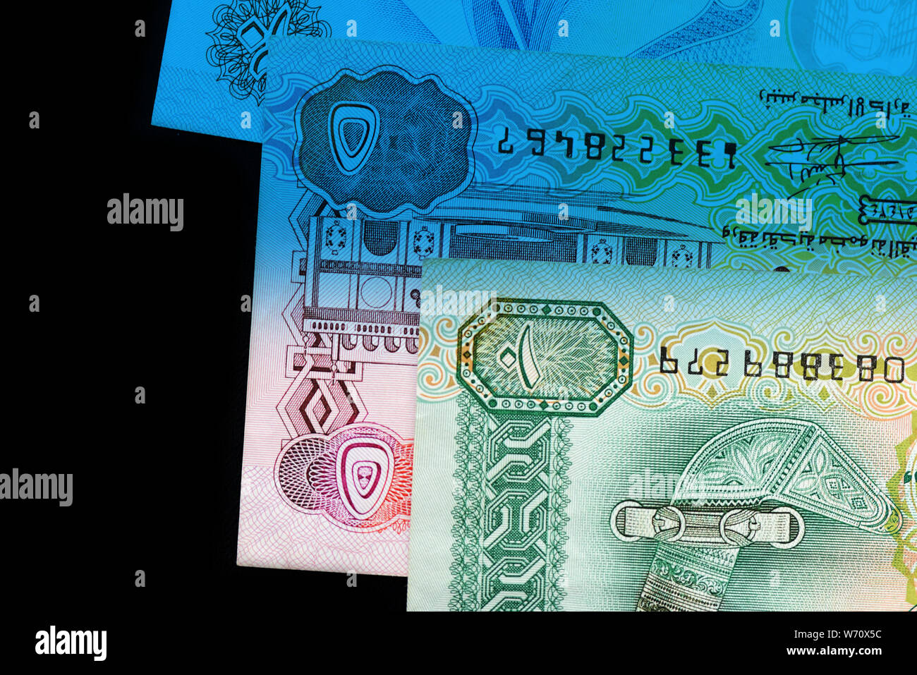 UAE dirham currency notes close up. Money background blue color toned ...