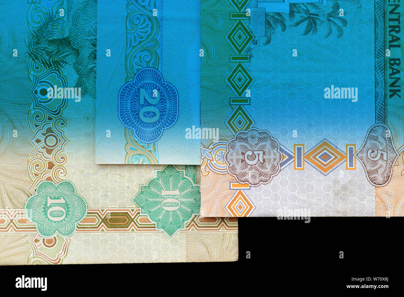 UAE dirham currency notes close up. Money background blue color toned ...