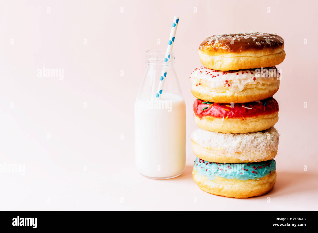 Tower of donuts and milk in a bottle Stock Photo - Alamy