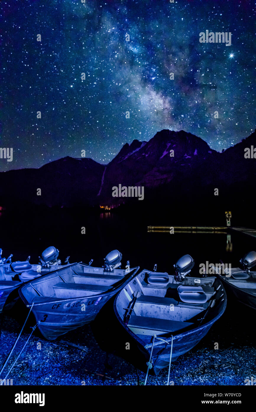 starry night sky with milky way, mountains, and boats Stock Photo - Alamy